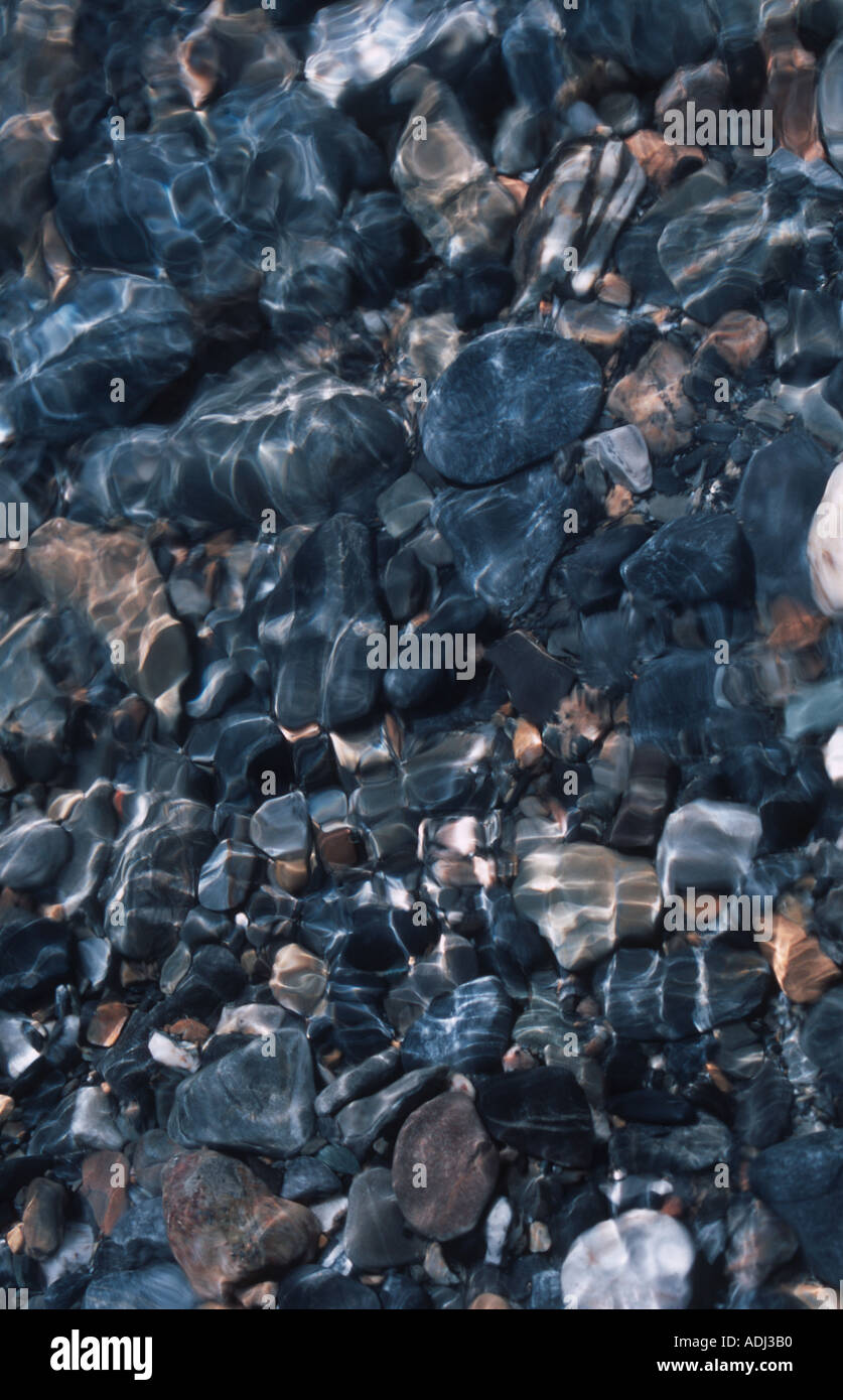 pebbles through water Stock Photo - Alamy