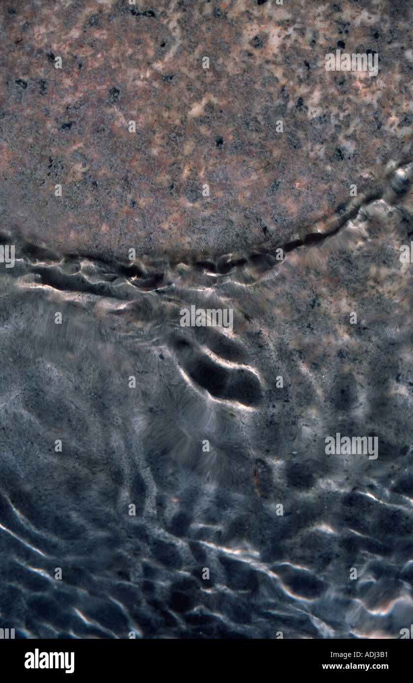 riverbed rock face through river water Stock Photo - Alamy