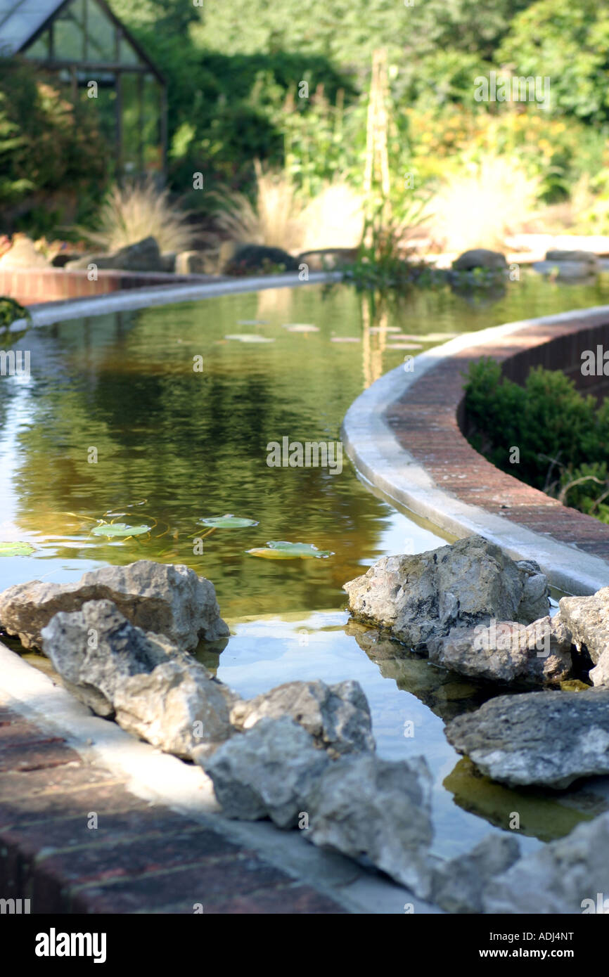 Water feature with rocks in a garden Stock Photo - Alamy