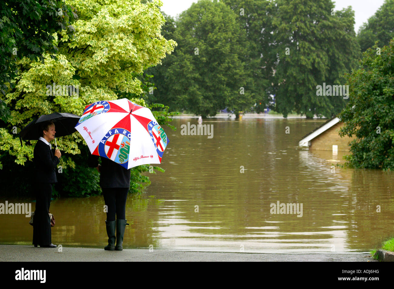 two womans watching their drowned house, flooded Somerset, England ...