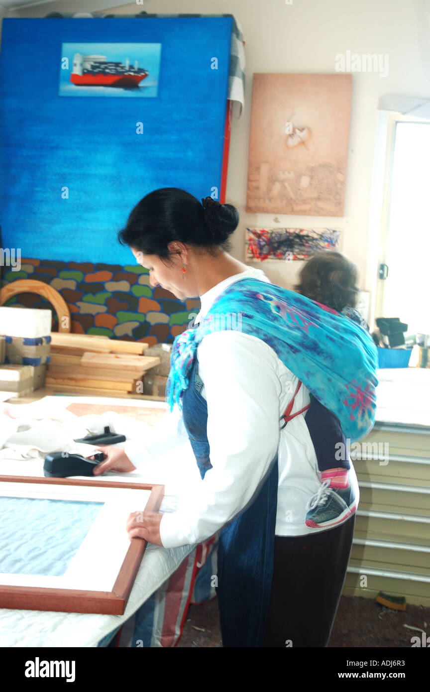 Artist and child work in studio ot finish an exhibition Stock Photo - Alamy