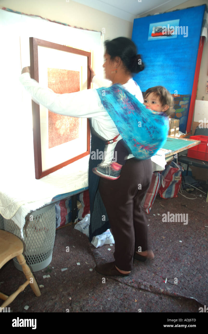 Artist and child work in studio ot finish an exhibition Stock Photo - Alamy