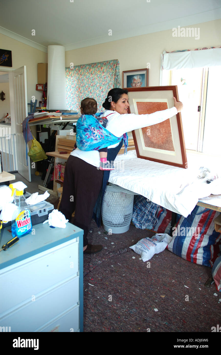 Artist and child work in studio ot finish an exhibition Stock Photo - Alamy