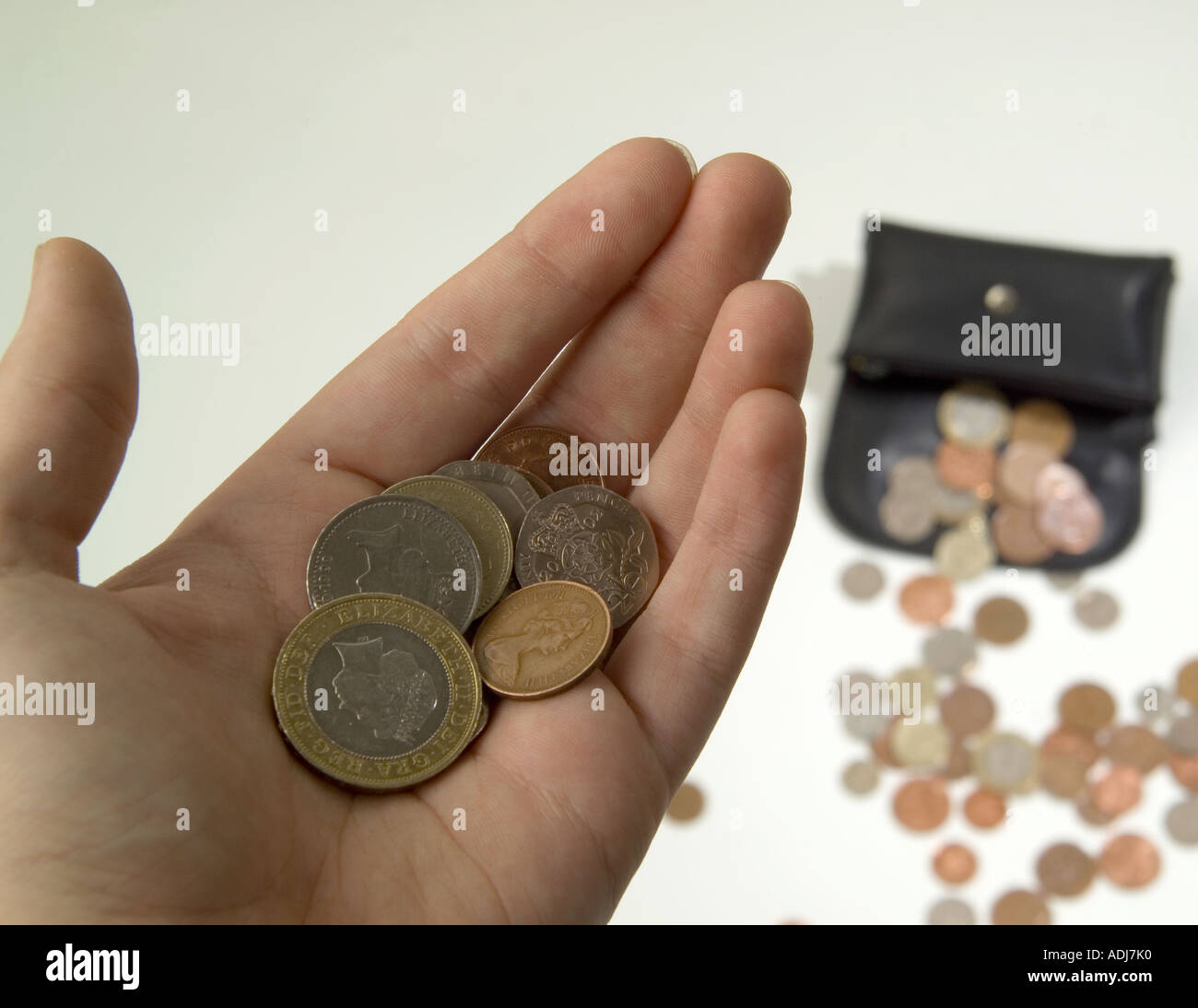 Hand coins in hand hi-res stock photography and images - Alamy