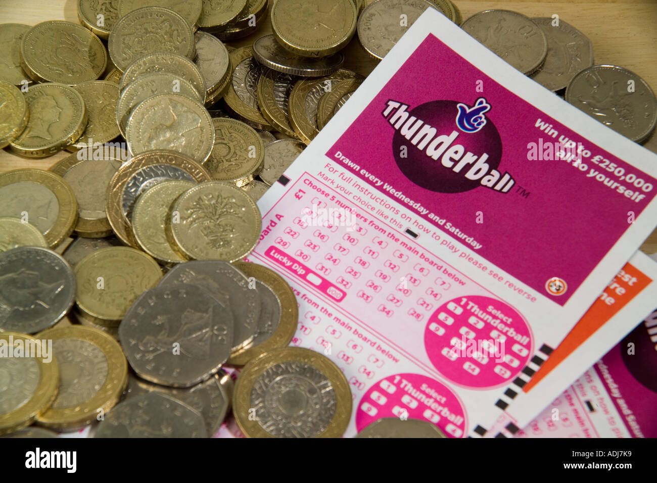 lottery tickets with pound coins Stock Photo - Alamy
