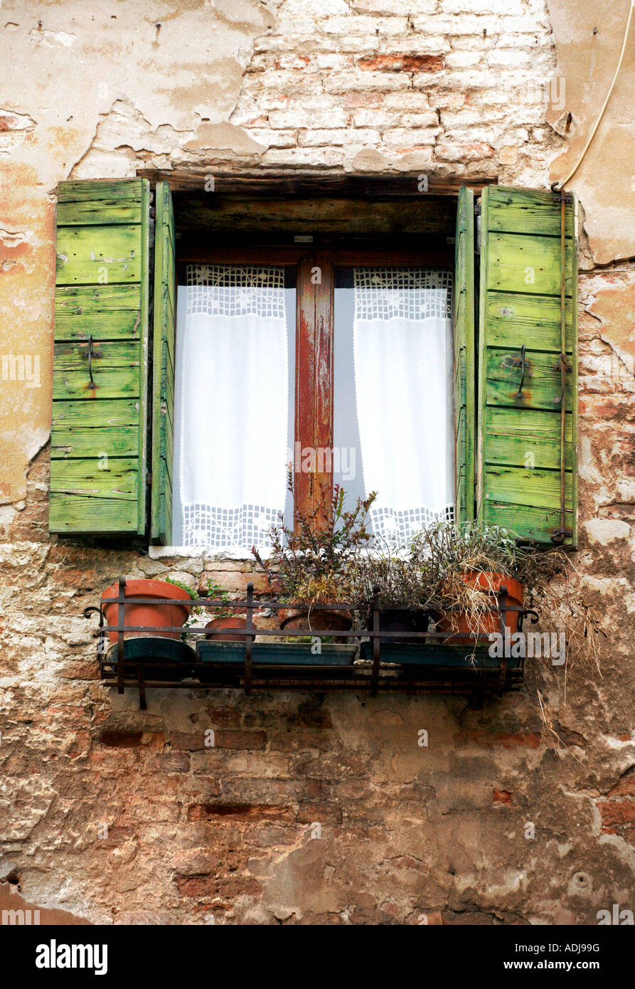 Detail of a window of grungy house Stock Photo - Alamy