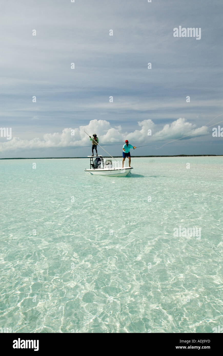 GREATER EXUMA BAHAMA Fly fisherman fishing for Bone -Fish in Emerald ...