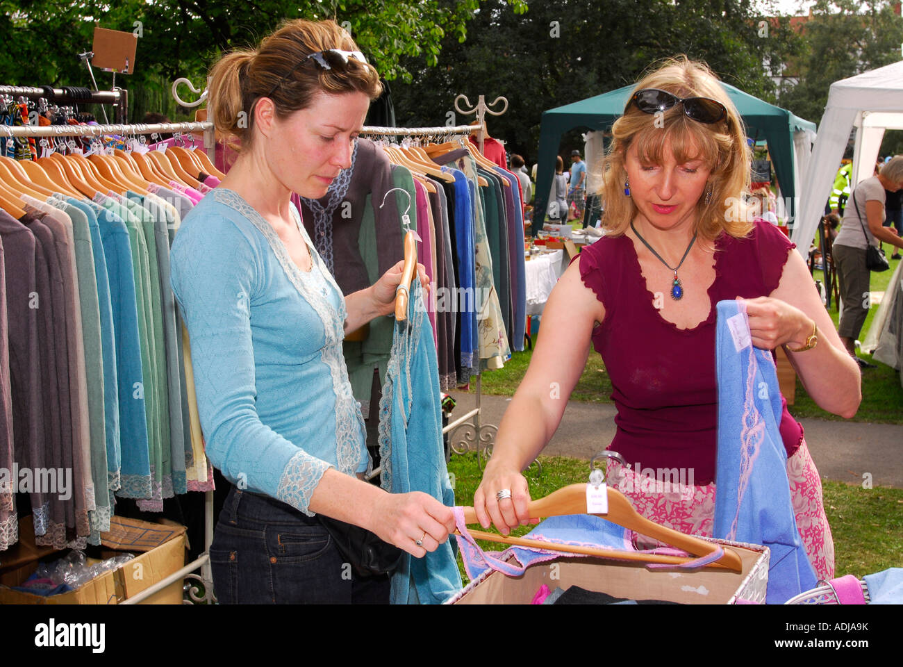 Women perusing clothes stall at Barnes Fair July 2007 Stock Photo - Alamy