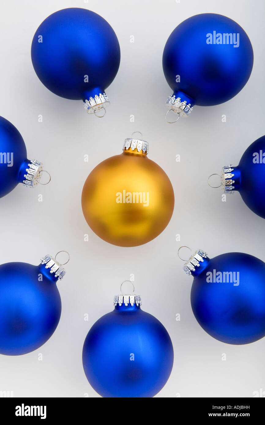 Group of blue Christmas tree balls placed in circle with gold ball in ...