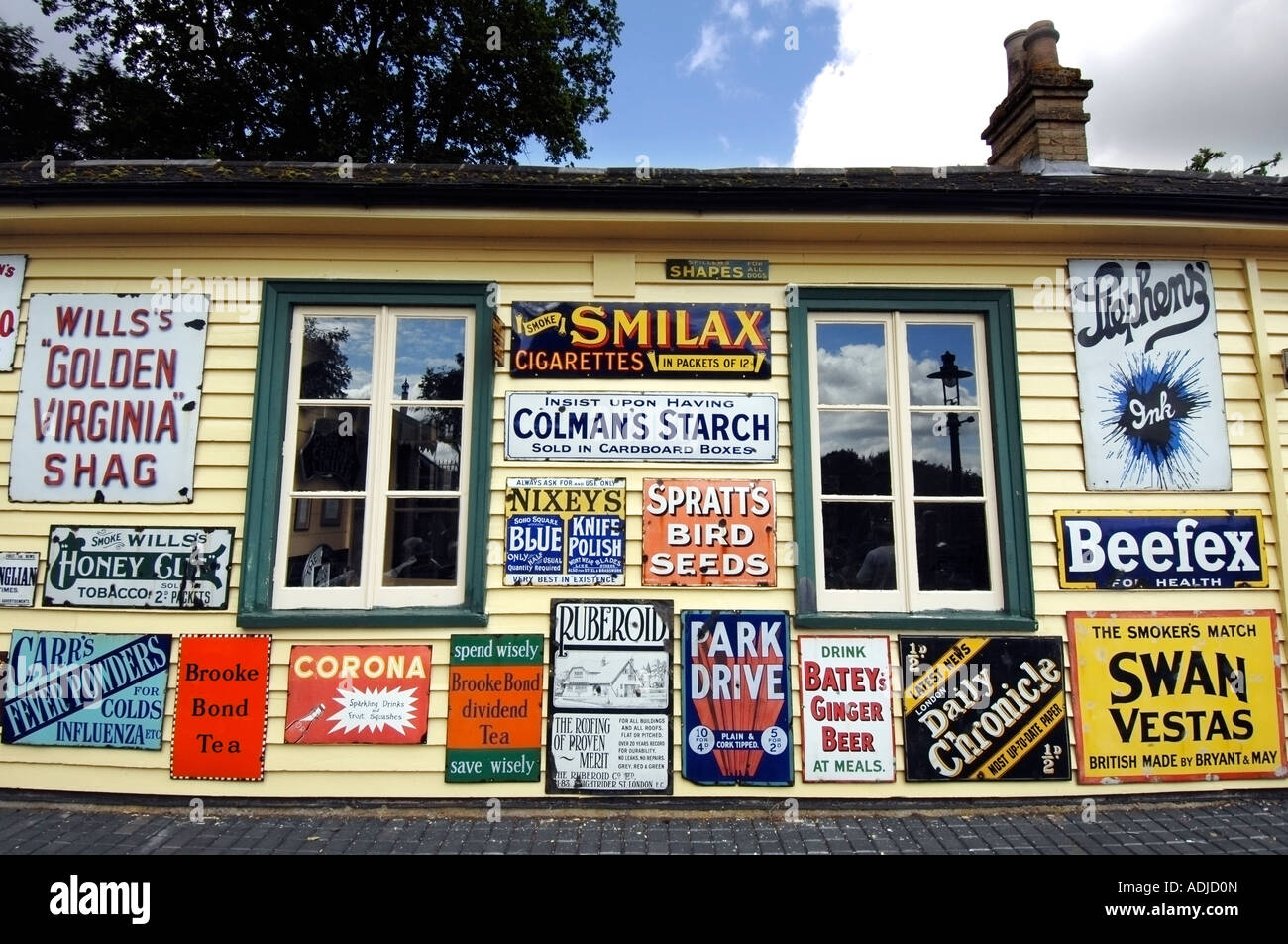 Old fashioned enamel advertising signs dating from 1920 to 1960 on a ...
