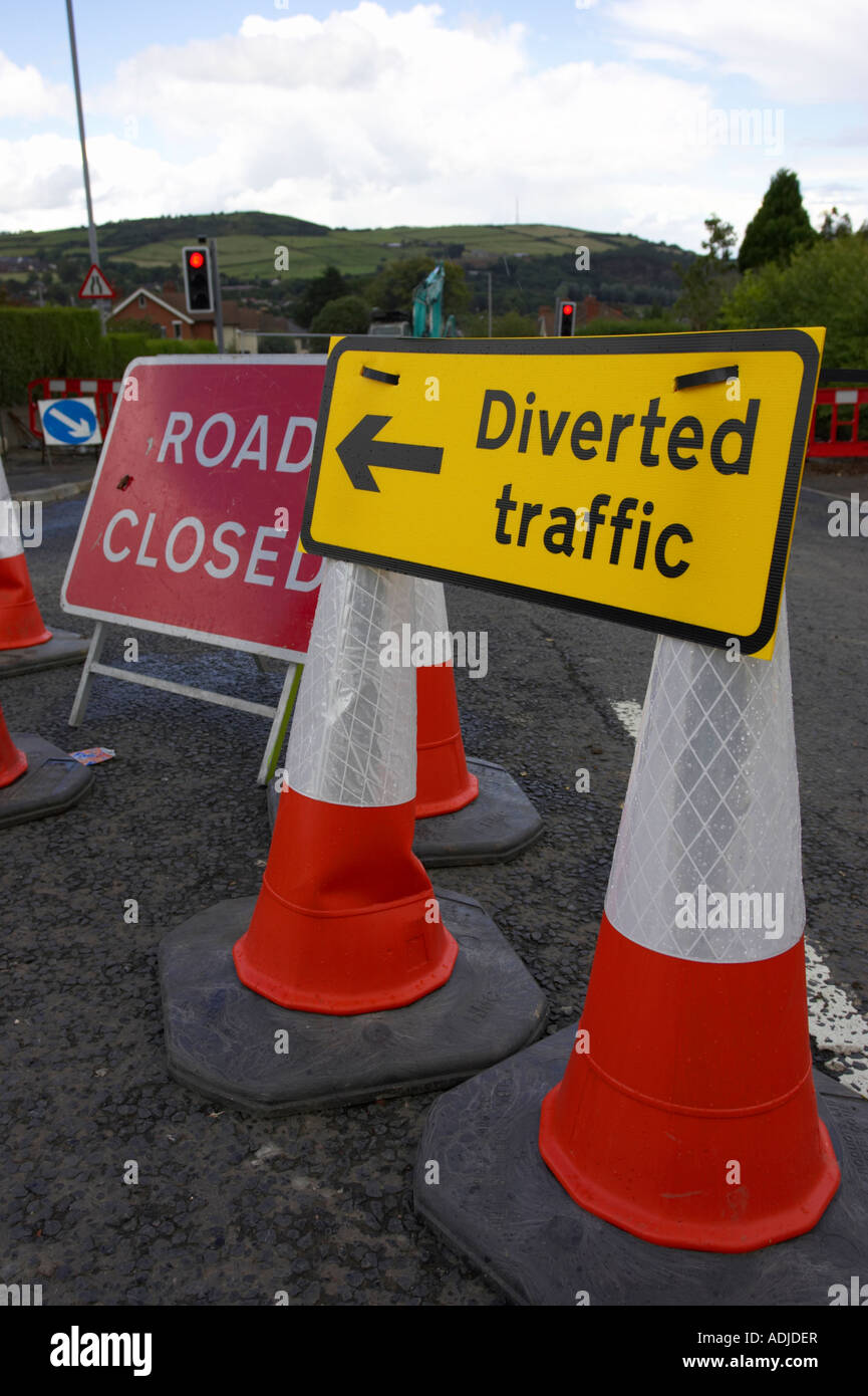 road closed sign and yellow diverted traffic sign on traffic cones due ...