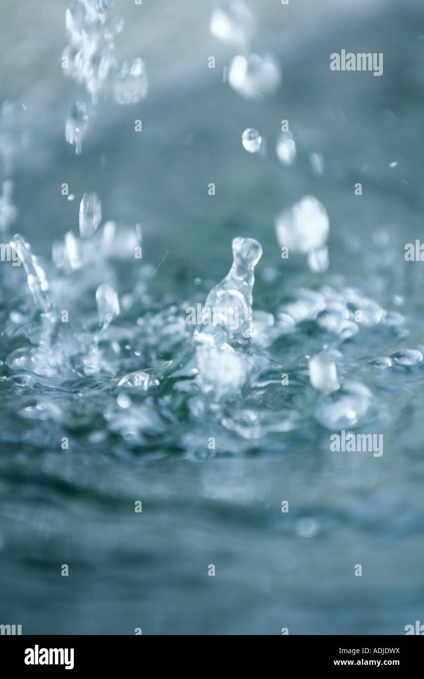 Drops of water hitting surface of water Stock Photo - Alamy