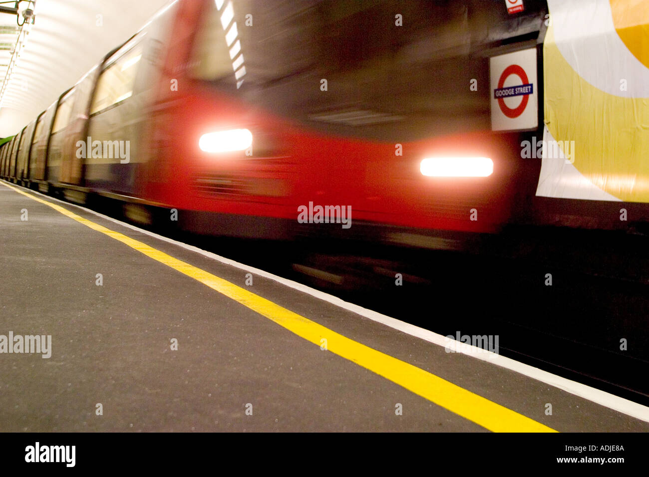 Underground Tube train zooms into Goodge Street station in London ...