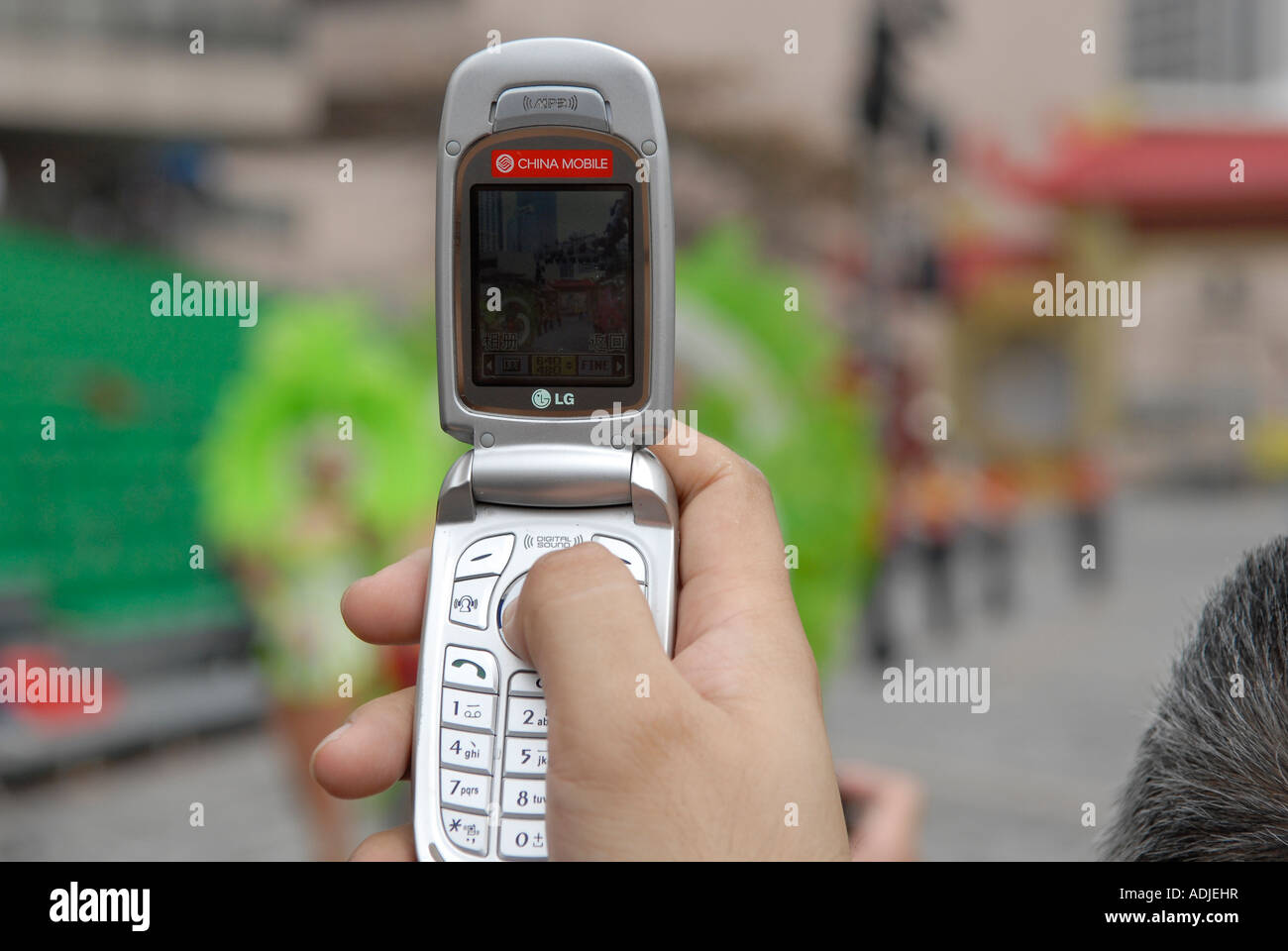 A man taking snapshots with his mobile phone Stock Photo - Alamy