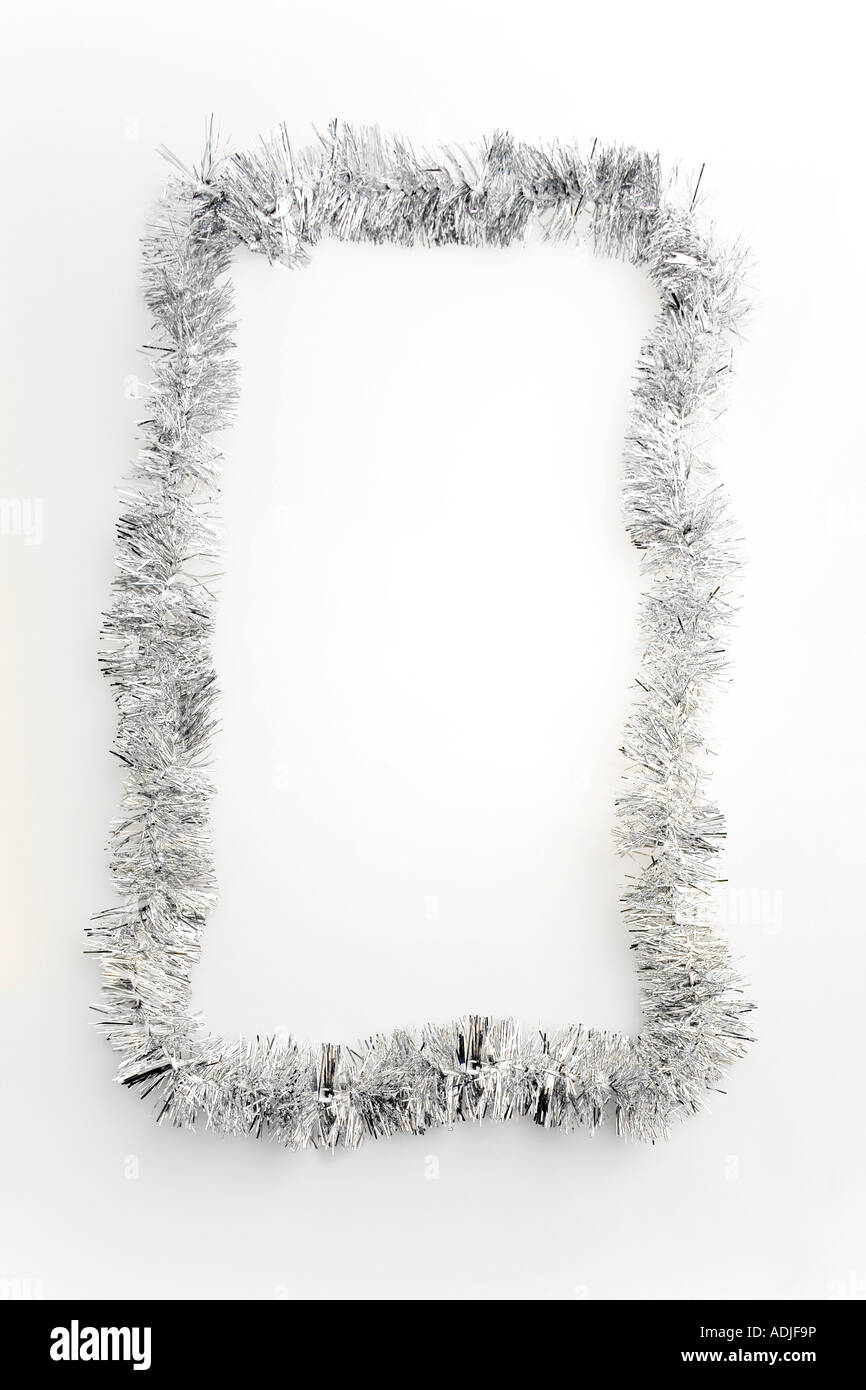 One strand of silver tinsel garland shaped in vertical rectangle on ...