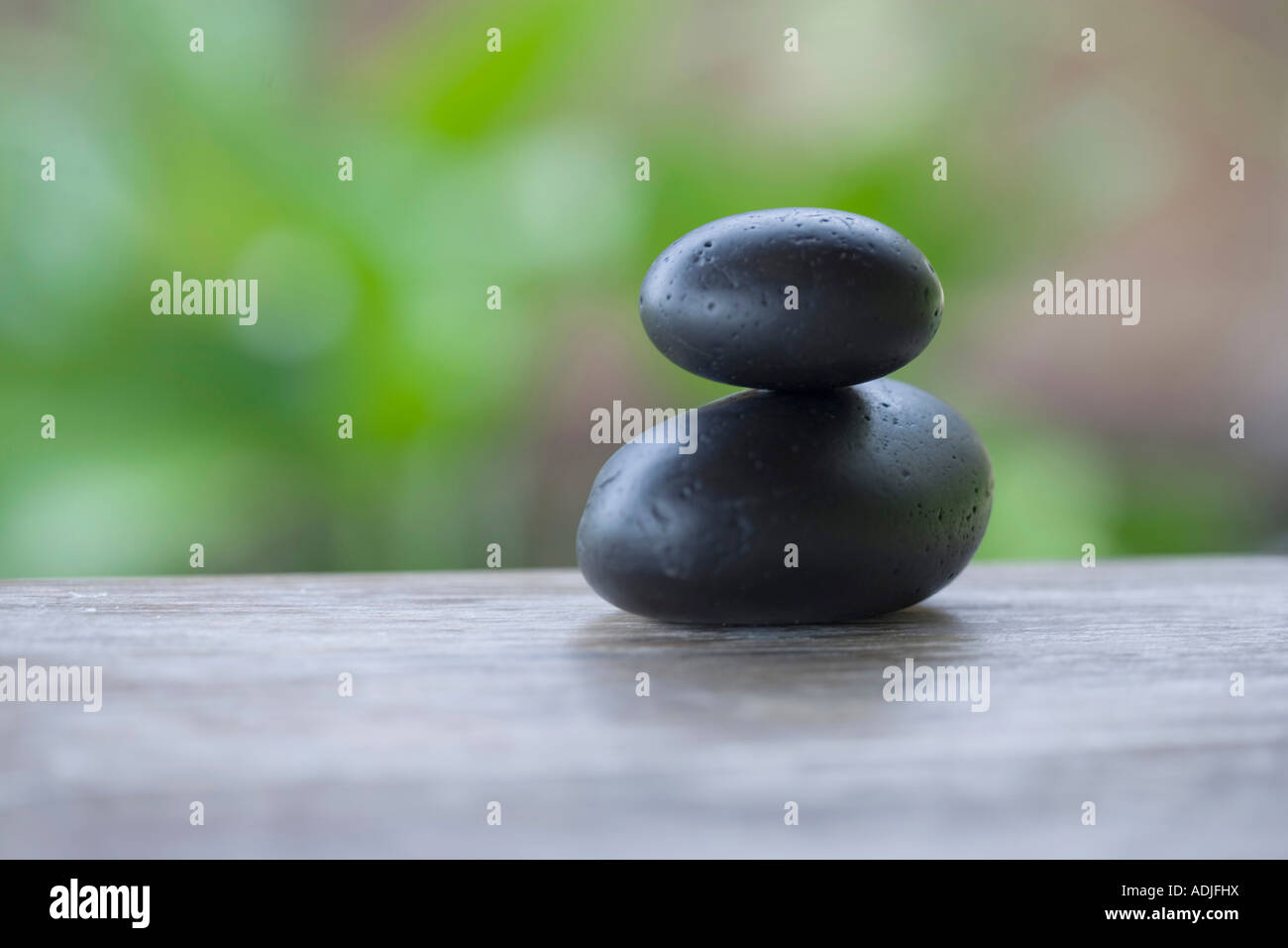 spa pebbles on a table Stock Photo - Alamy