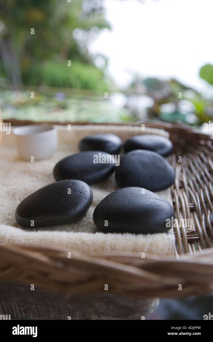 spa pebbles on a basket Stock Photo - Alamy