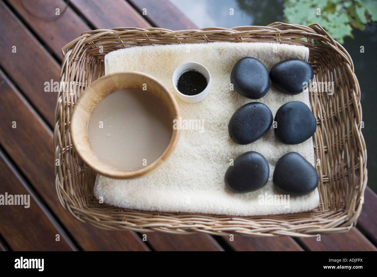spa pebbles on a basket Stock Photo - Alamy