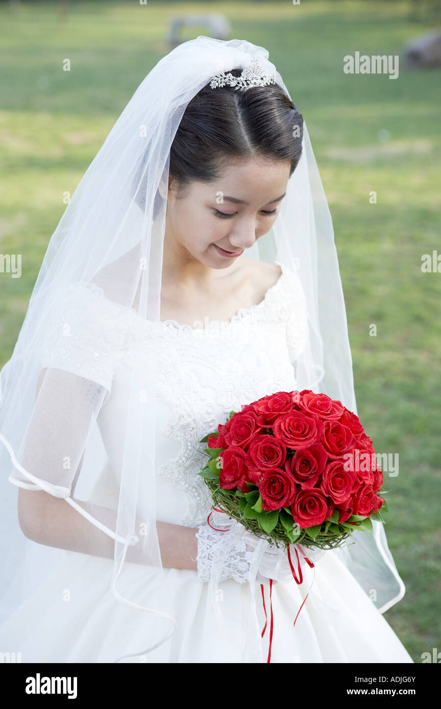 Wedding a bride holding a bouquet Stock Photo - Alamy