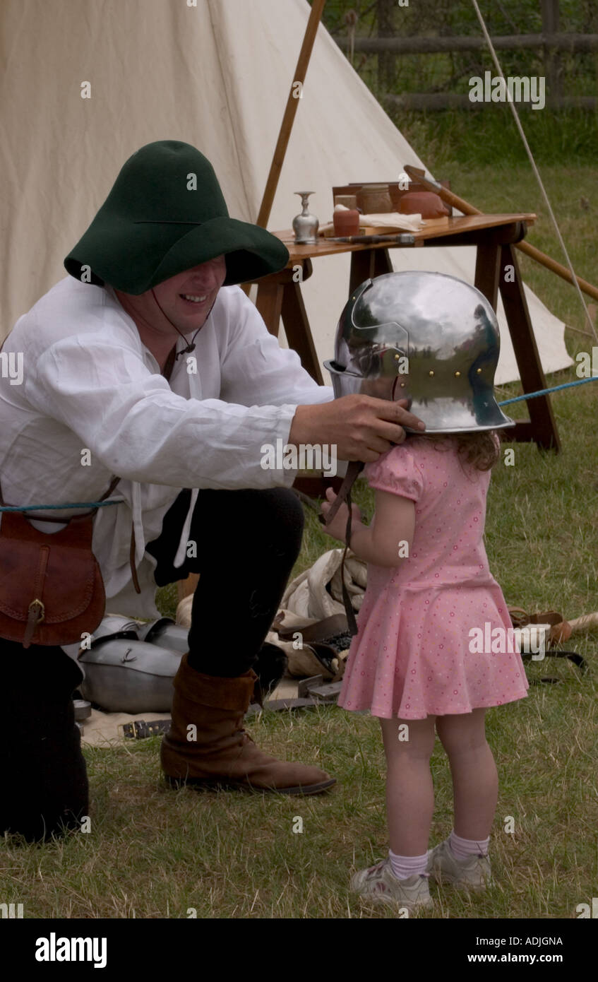 medieval helmet on a little girl in uk Stock Photo - Alamy