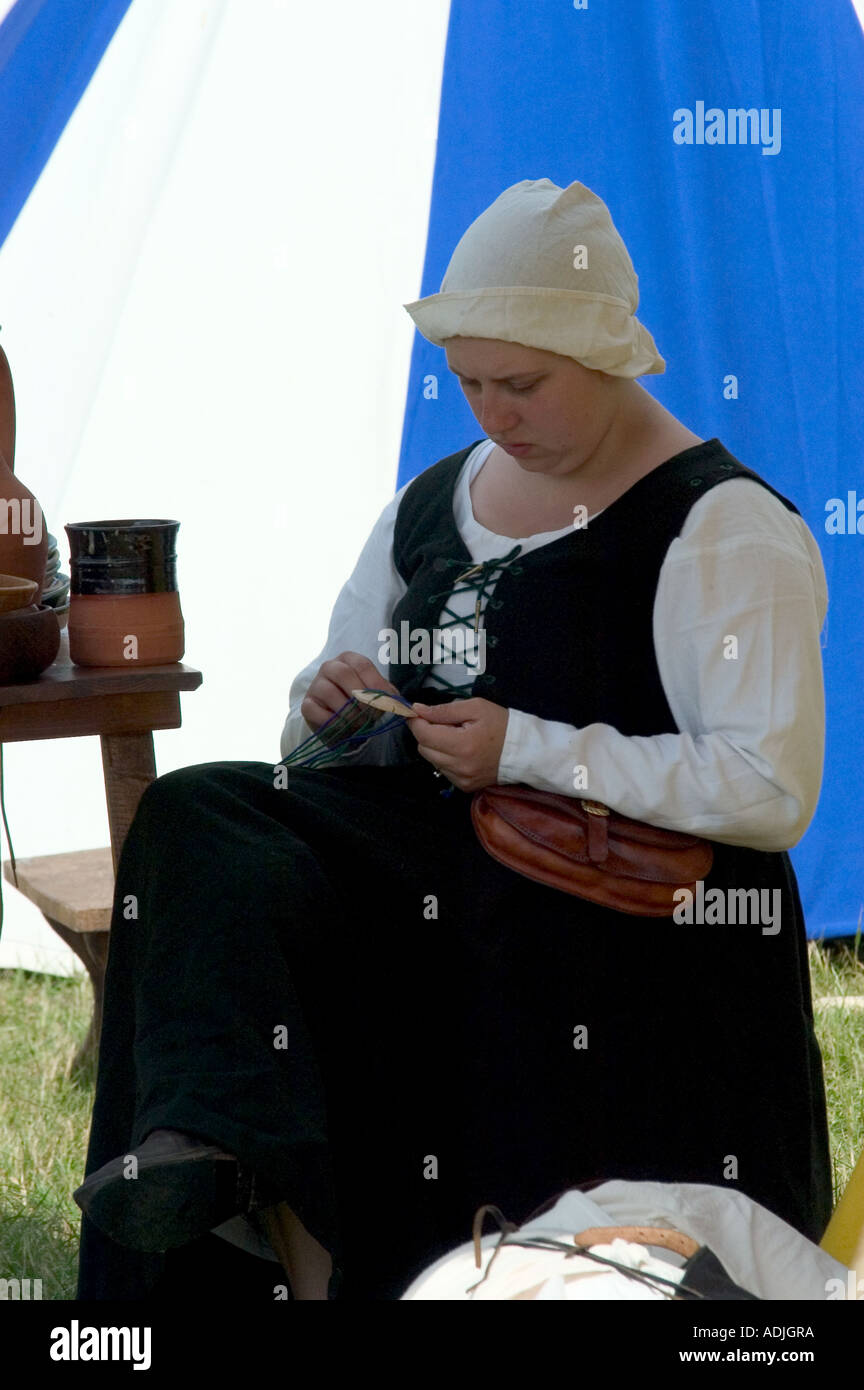 woman sewing in medieval costume Stock Photo - Alamy