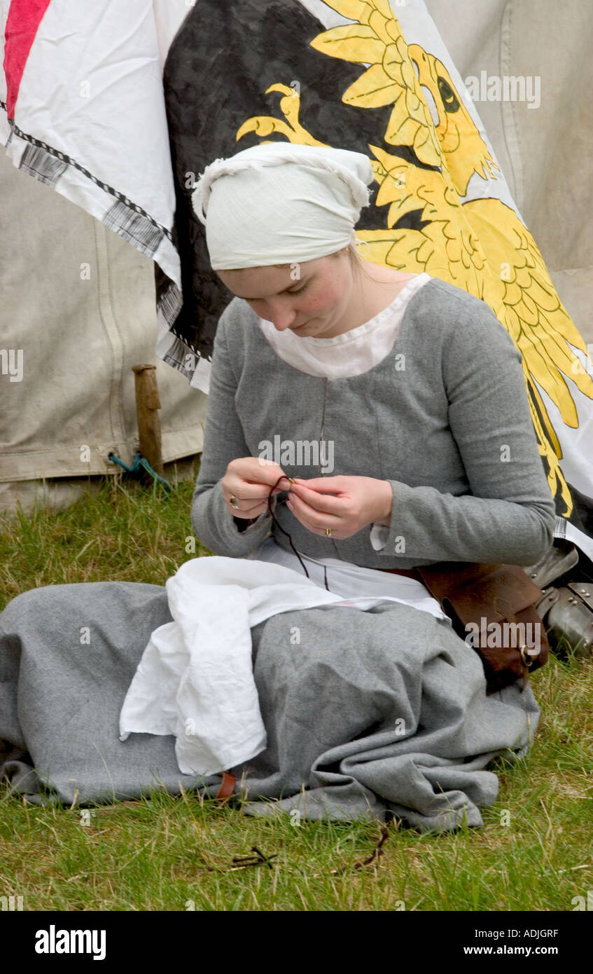 woman sewing in medieval costume Stock Photo - Alamy