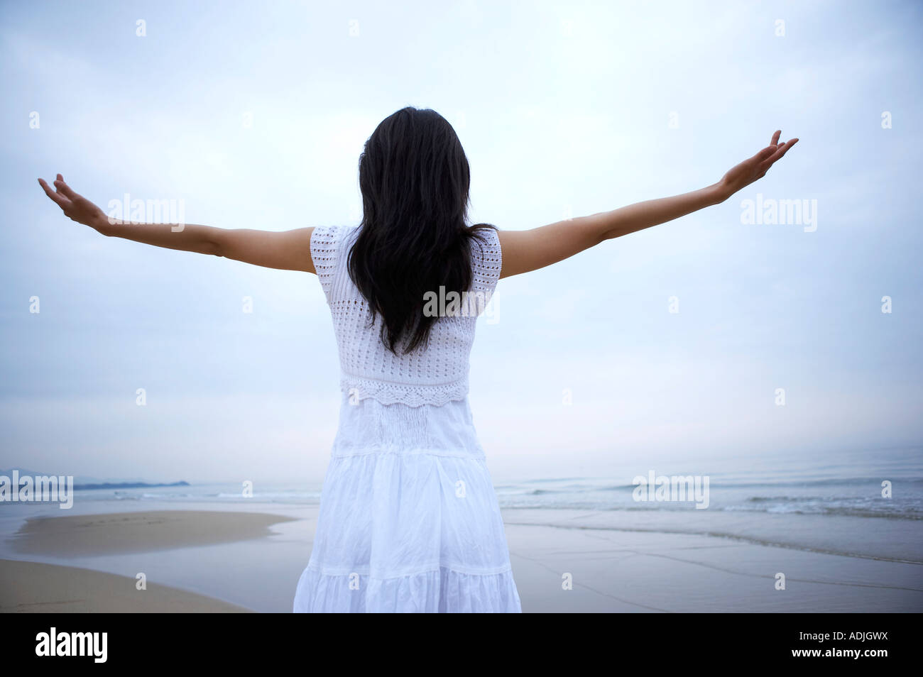 back figure of the couple with stretching arms Stock Photo - Alamy