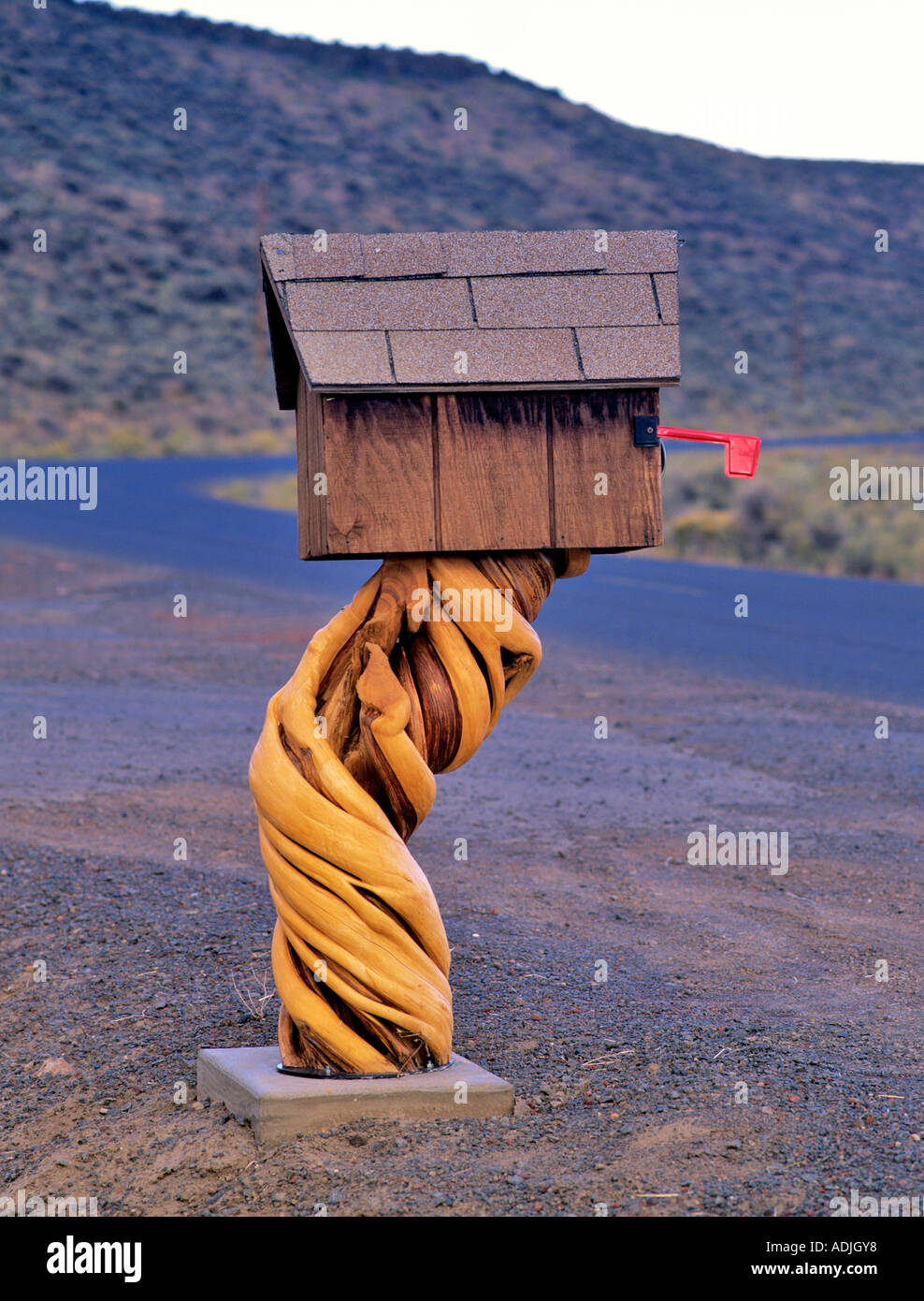 Mailbox with post of twisted tree Harney County Oregon Stock Photo - Alamy