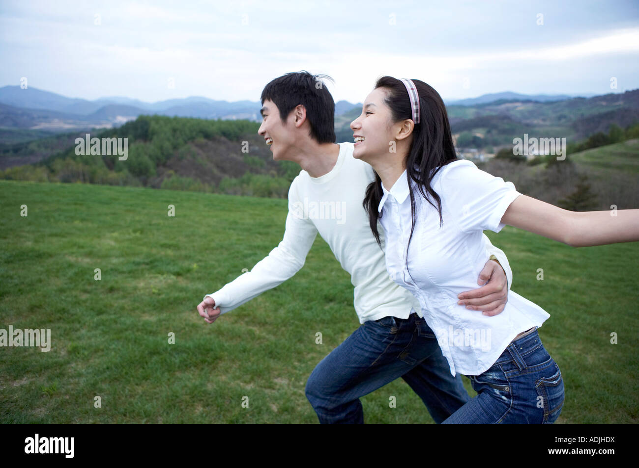 Couple running across hi-res stock photography and images - Alamy