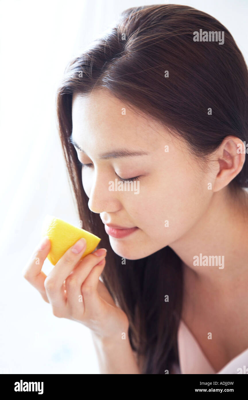woman smelling lemon Stock Photo - Alamy