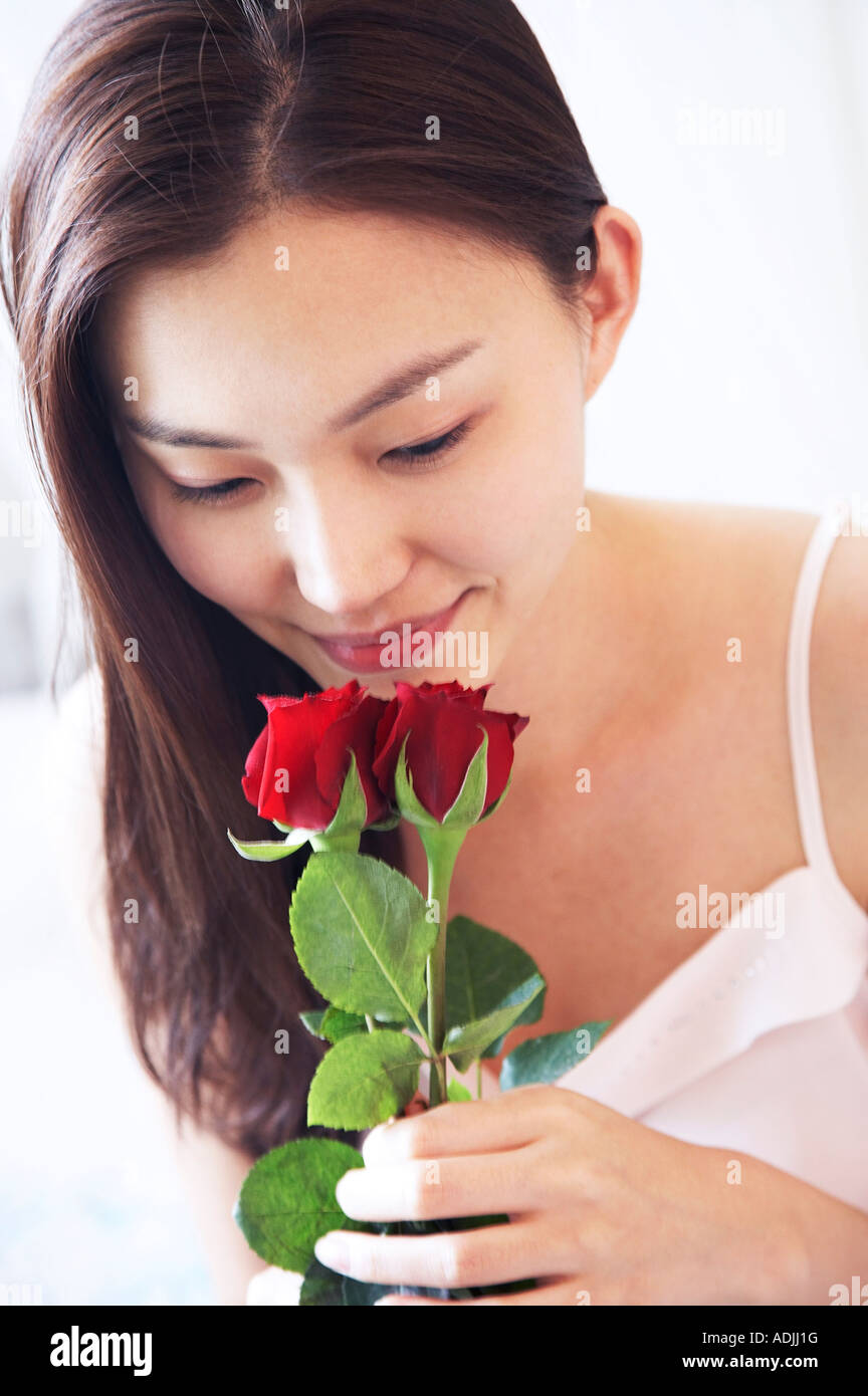 woman smelling rose Stock Photo - Alamy