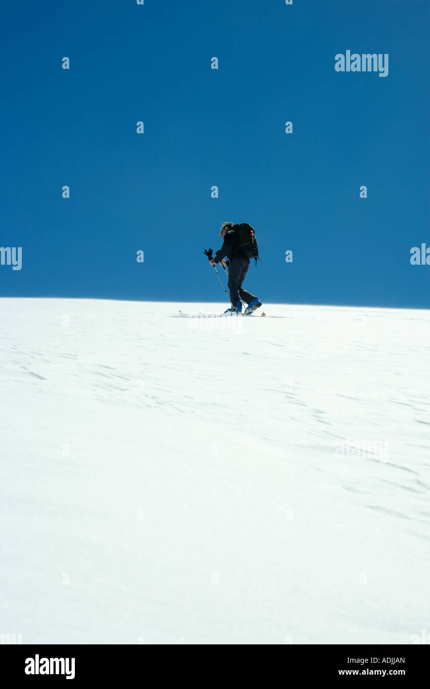 Skier standing on slope, low angle view Stock Photo - Alamy