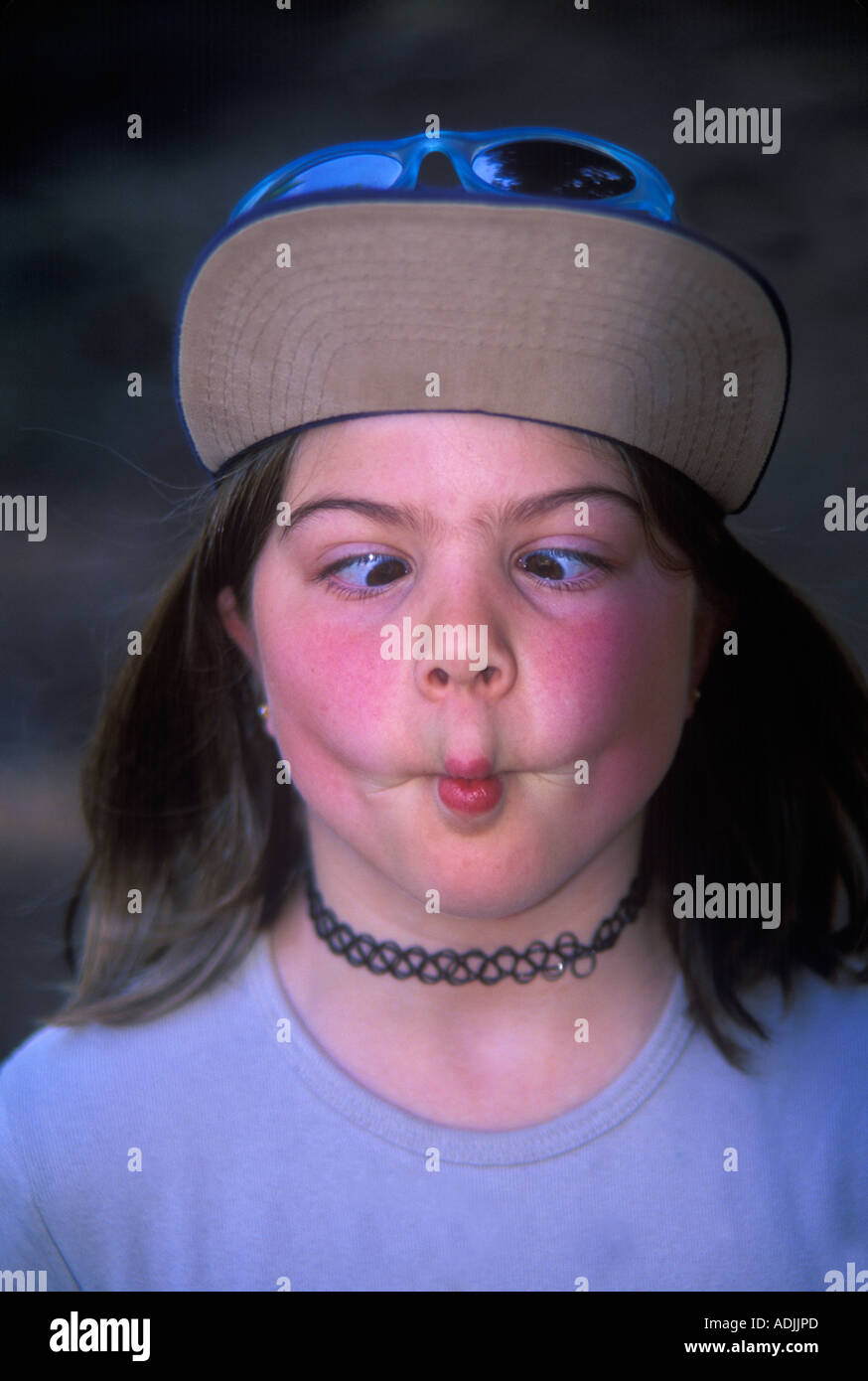 Young girl making funny face Stock Photo - Alamy