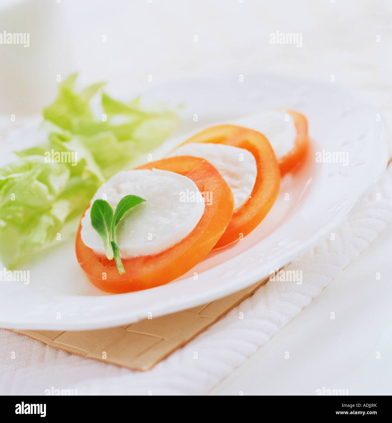 mozzarella cheese tomato dish plate vegetable food Stock Photo - Alamy