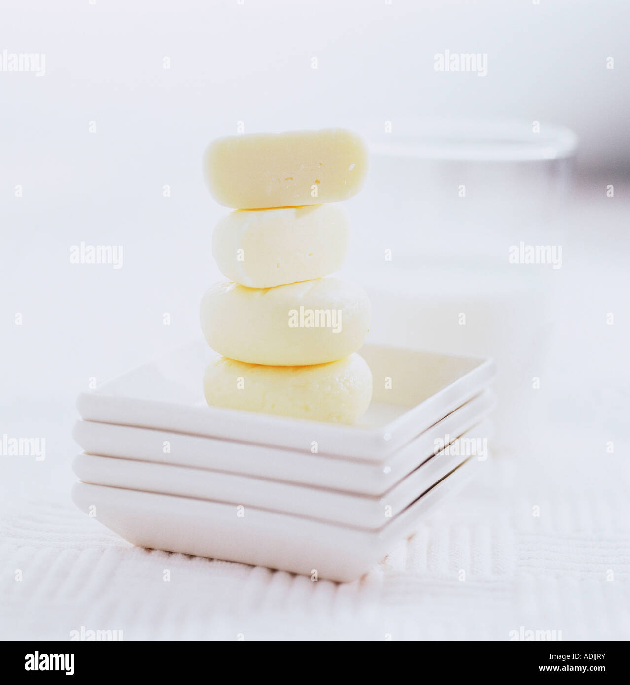 cheese chunk plate dish cup dairy food pile up Stock Photo - Alamy