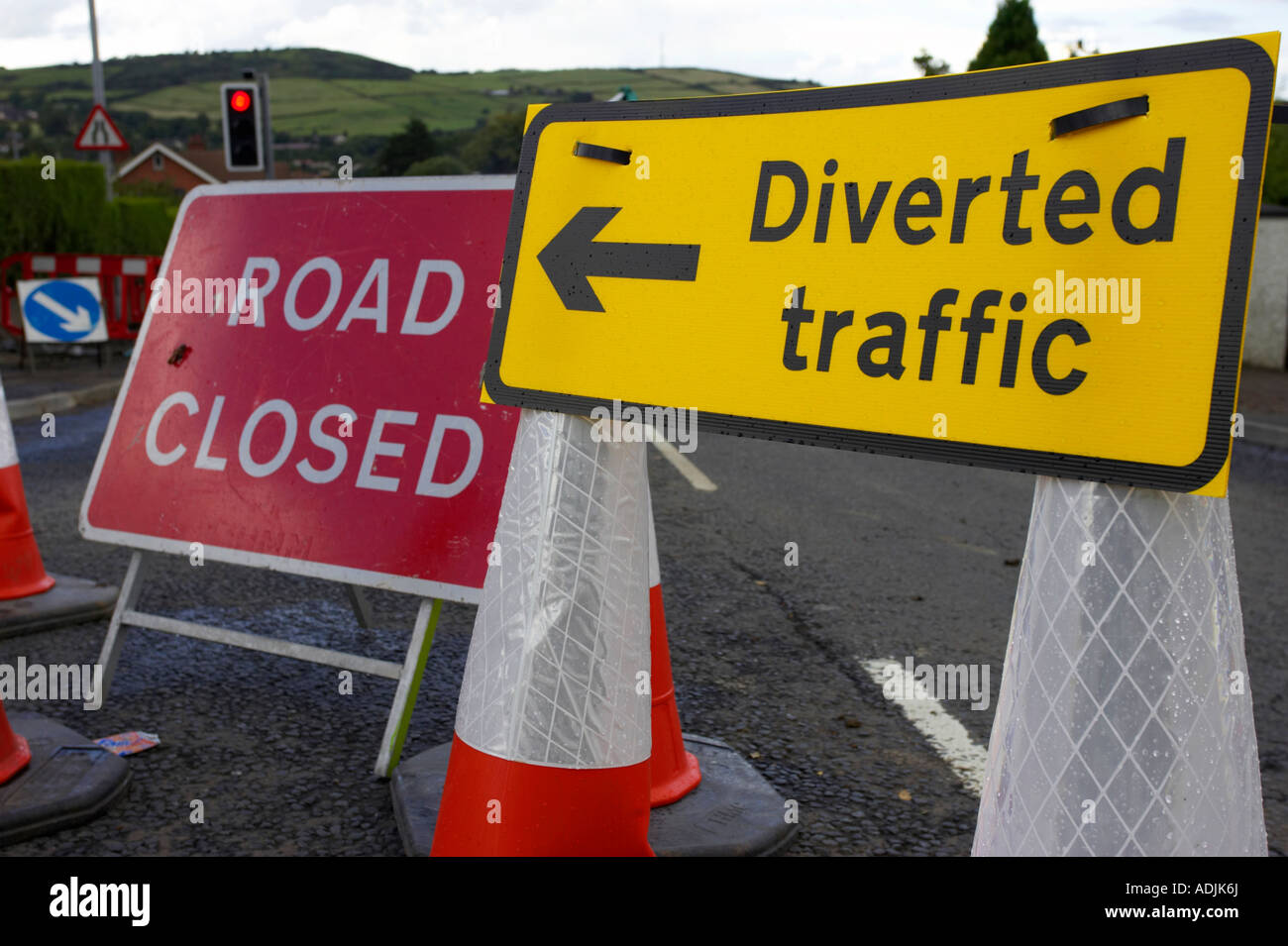 road closed sign and yellow diverted traffic sign on traffic cones due ...