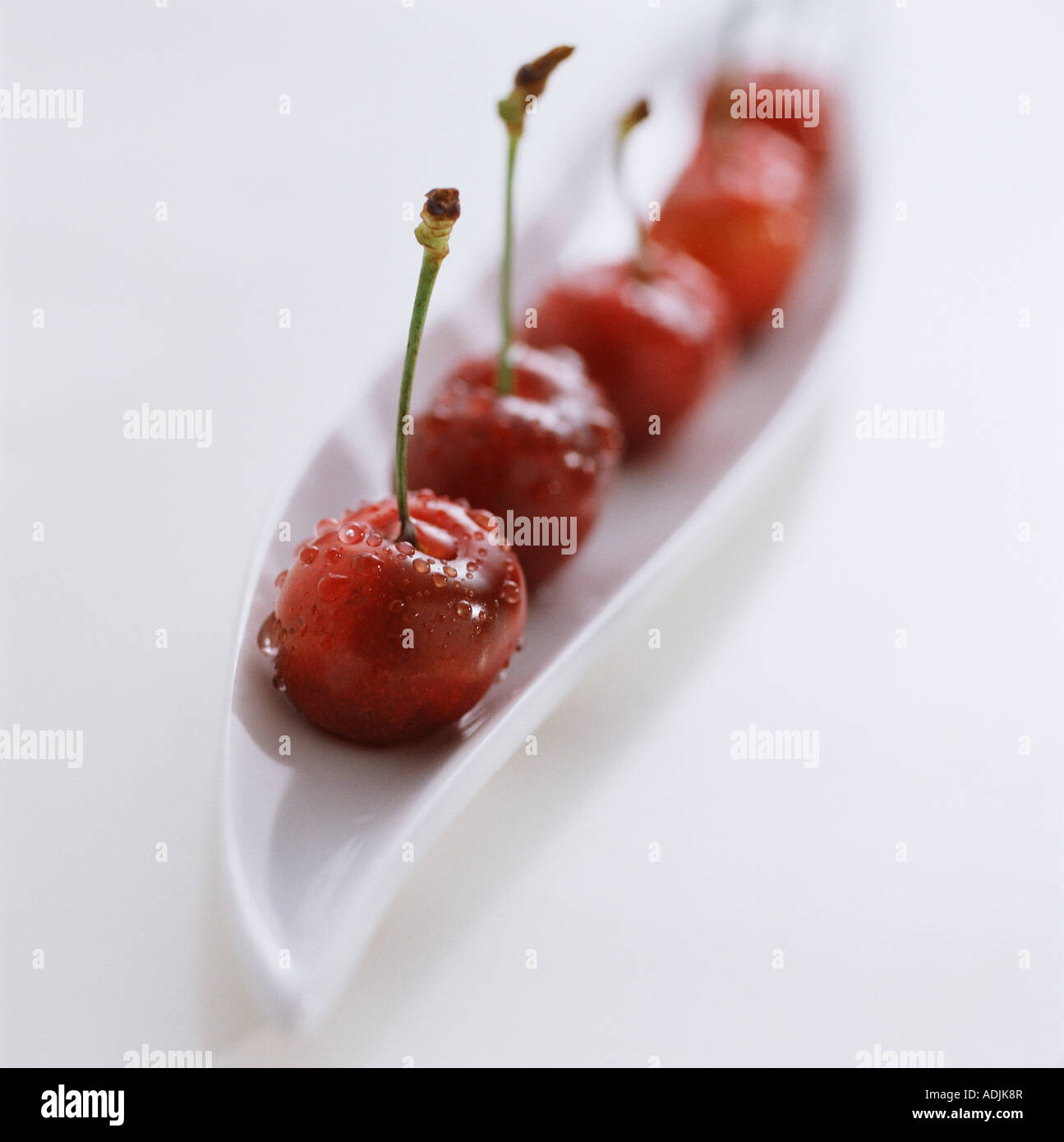 A line of cherries Stock Photo - Alamy