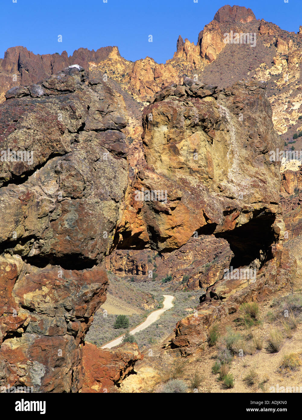 Road in Leslie Gulch as seen through rock arch Oregon Stock Photo - Alamy