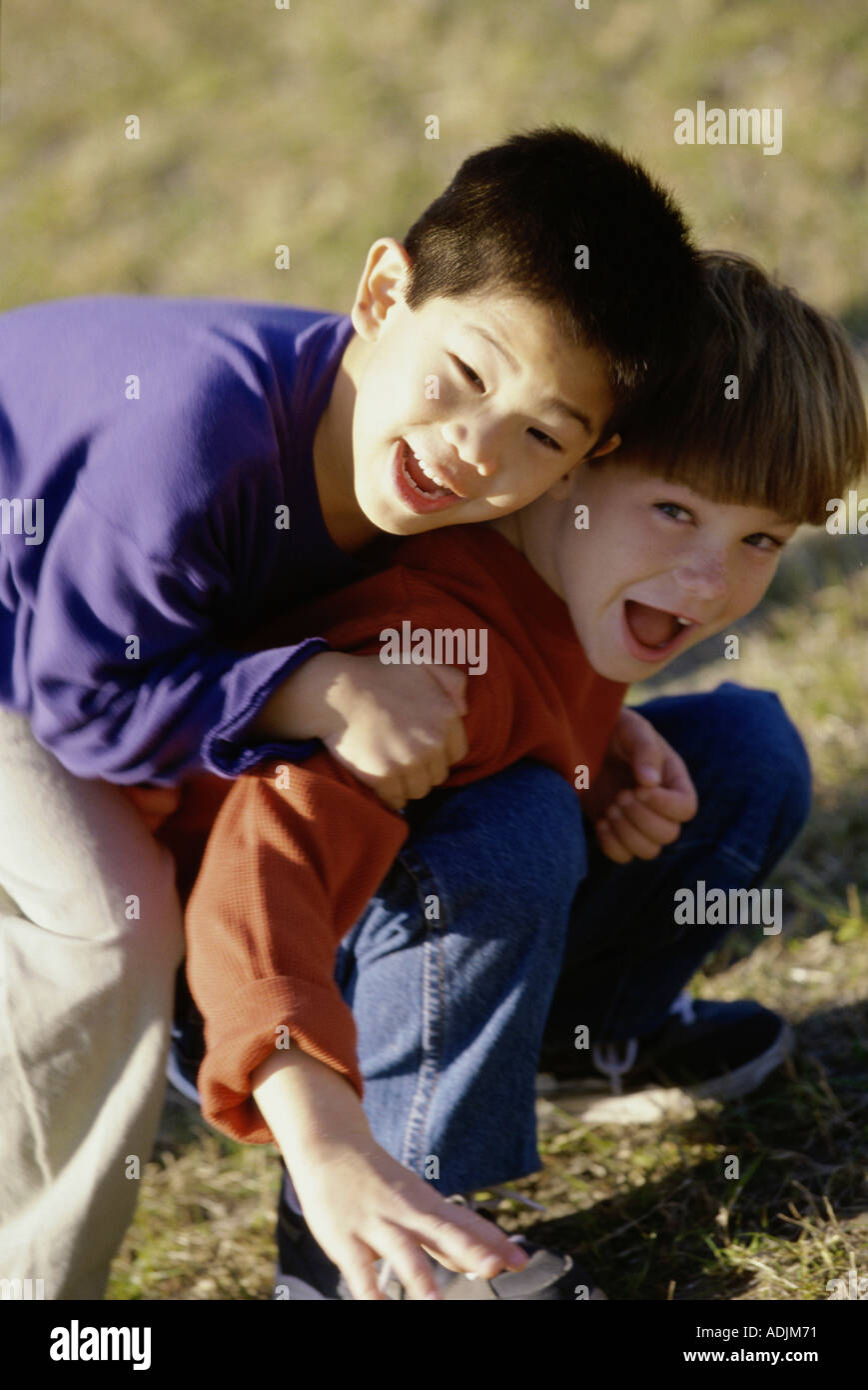 Side profile of two boys playing Stock Photo - Alamy