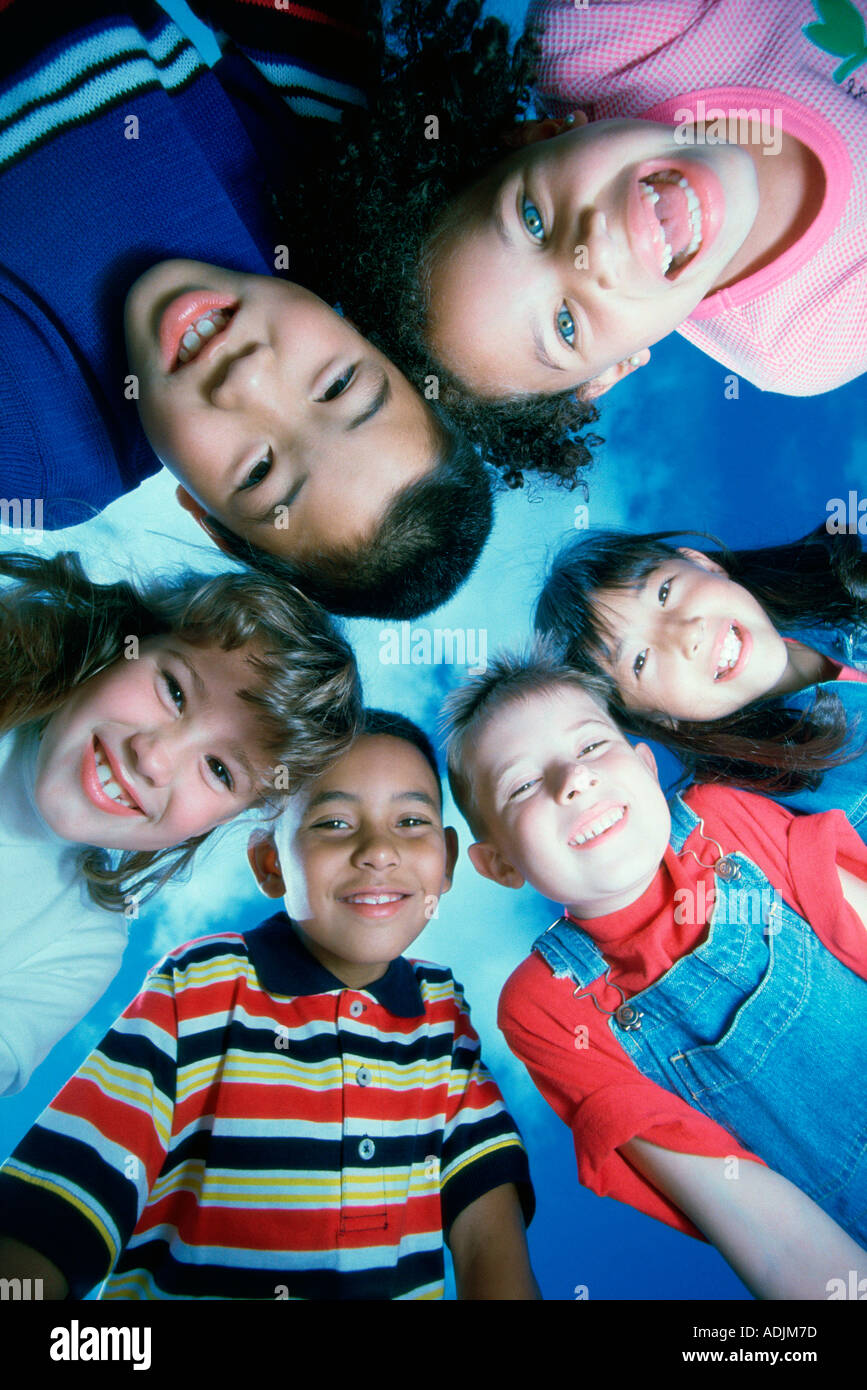 Close-up of a group of children in a huddle Stock Photo - Alamy