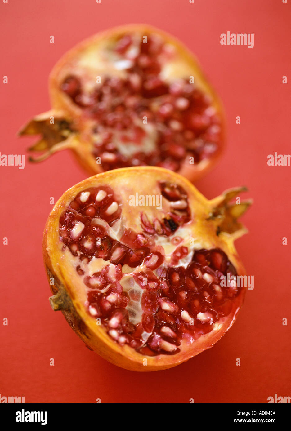 Halves of pomegranates hi-res stock photography and images - Alamy