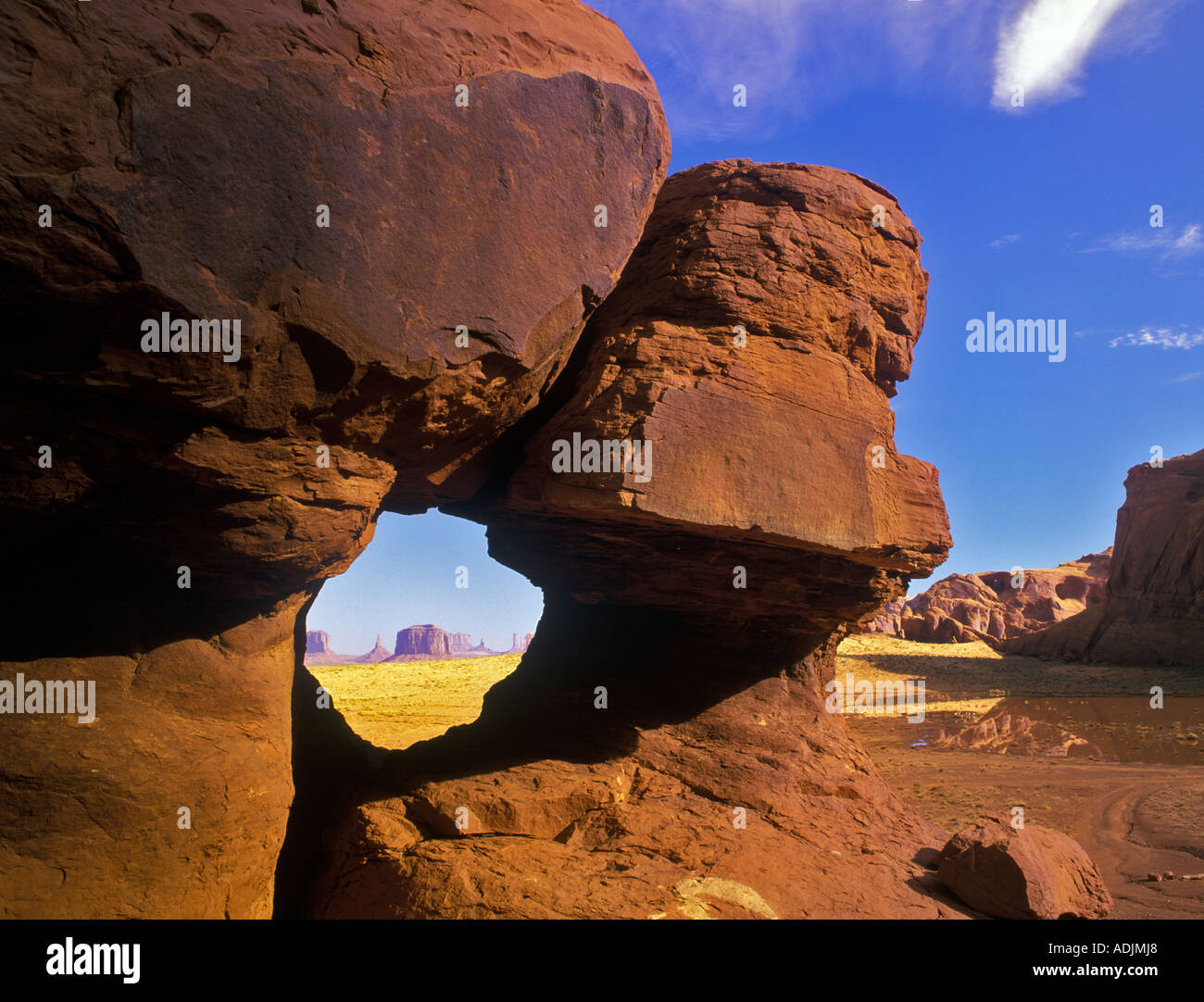 Pottery Arch framing rock structures Monument Valley Arizona Stock ...