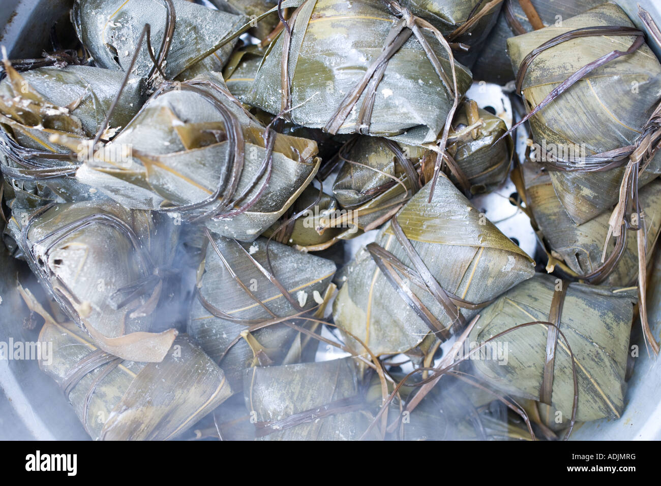 Banana leaf appetizers being steamed, close-up Stock Photo - Alamy