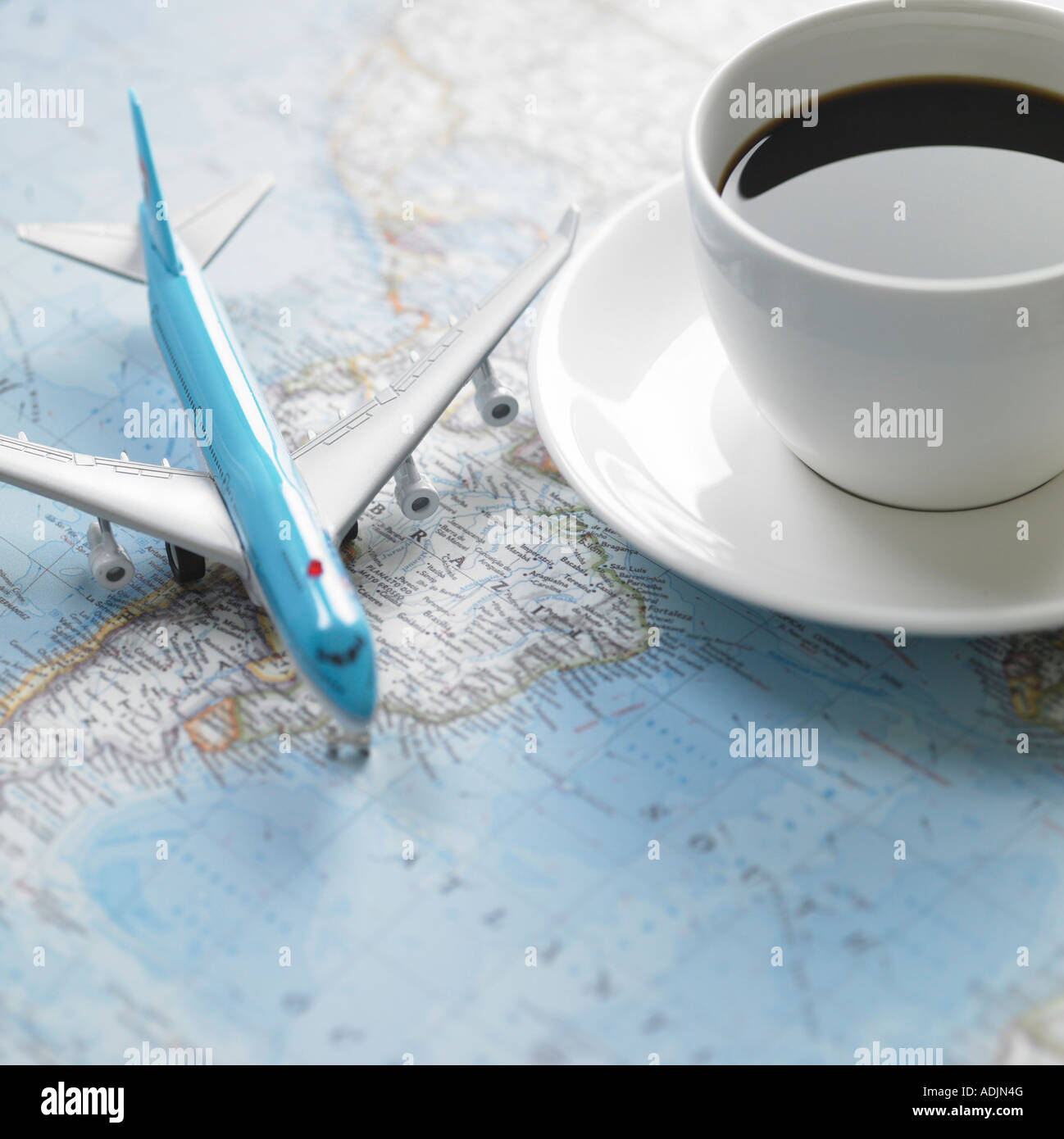 airplane figurine model map coffee cup cups Stock Photo - Alamy