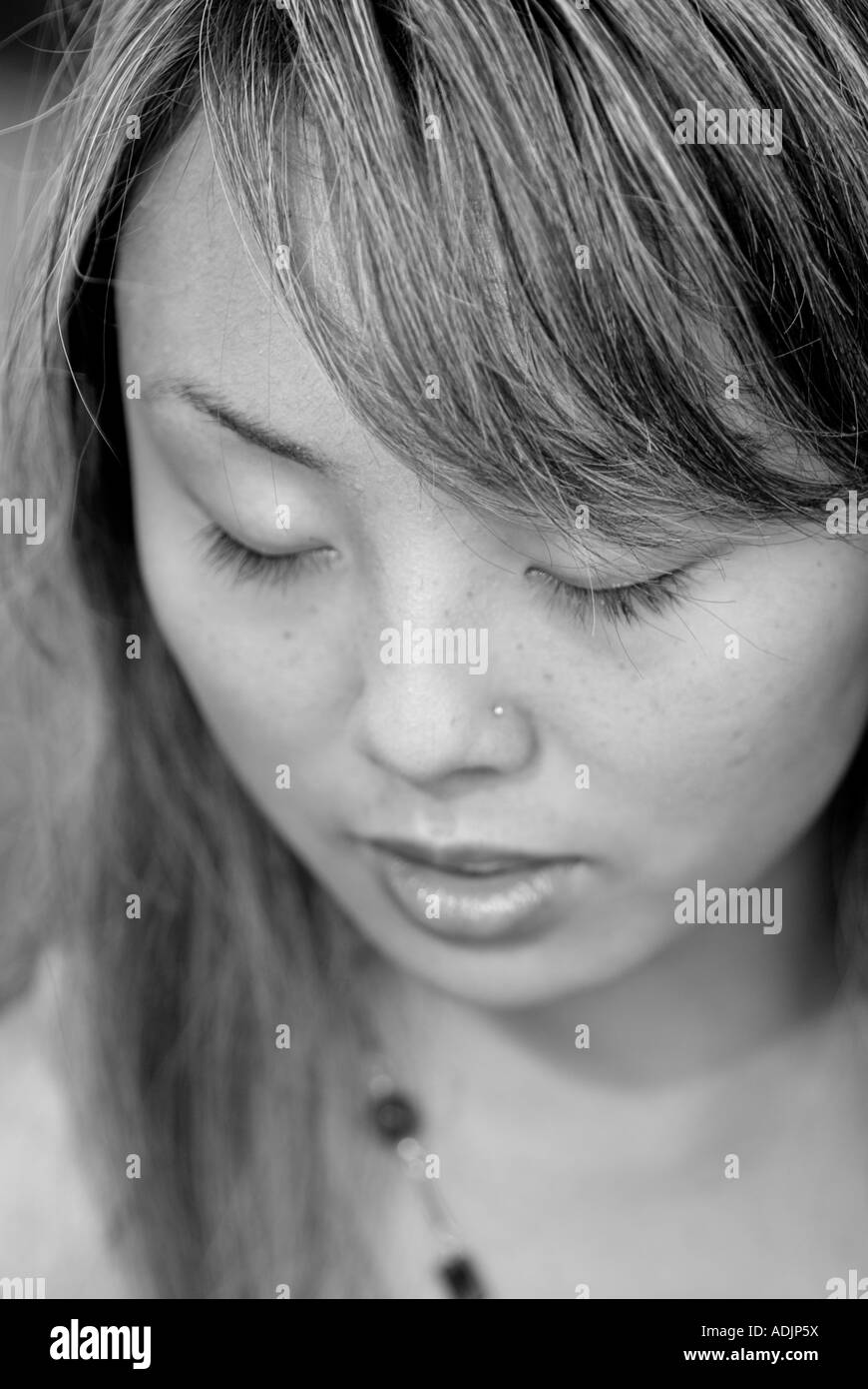 Headshot of a pretty young Asian woman Stock Photo - Alamy