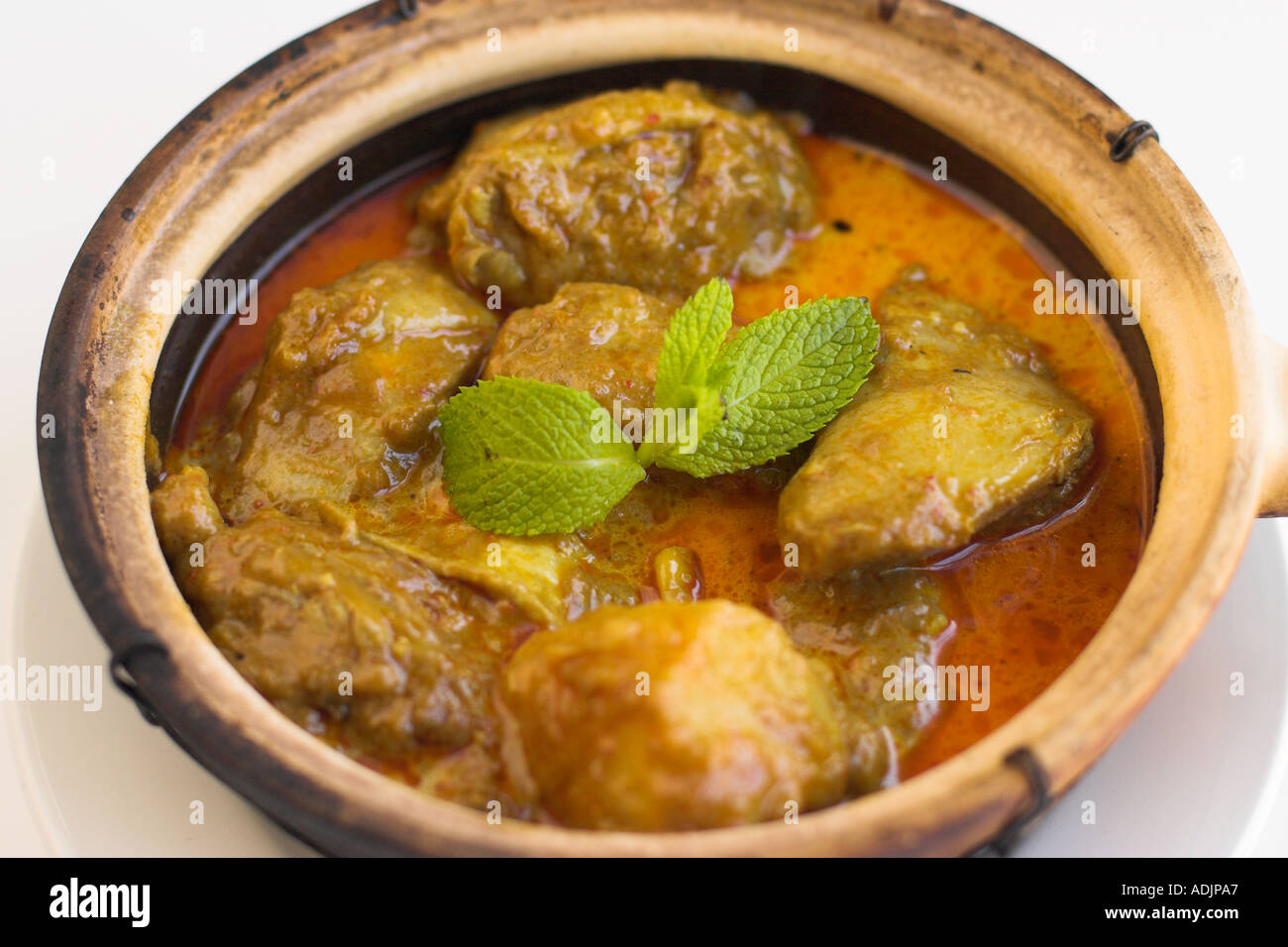 Chicken Red Curry with Patatoes in Claypot Stock Photo - Alamy