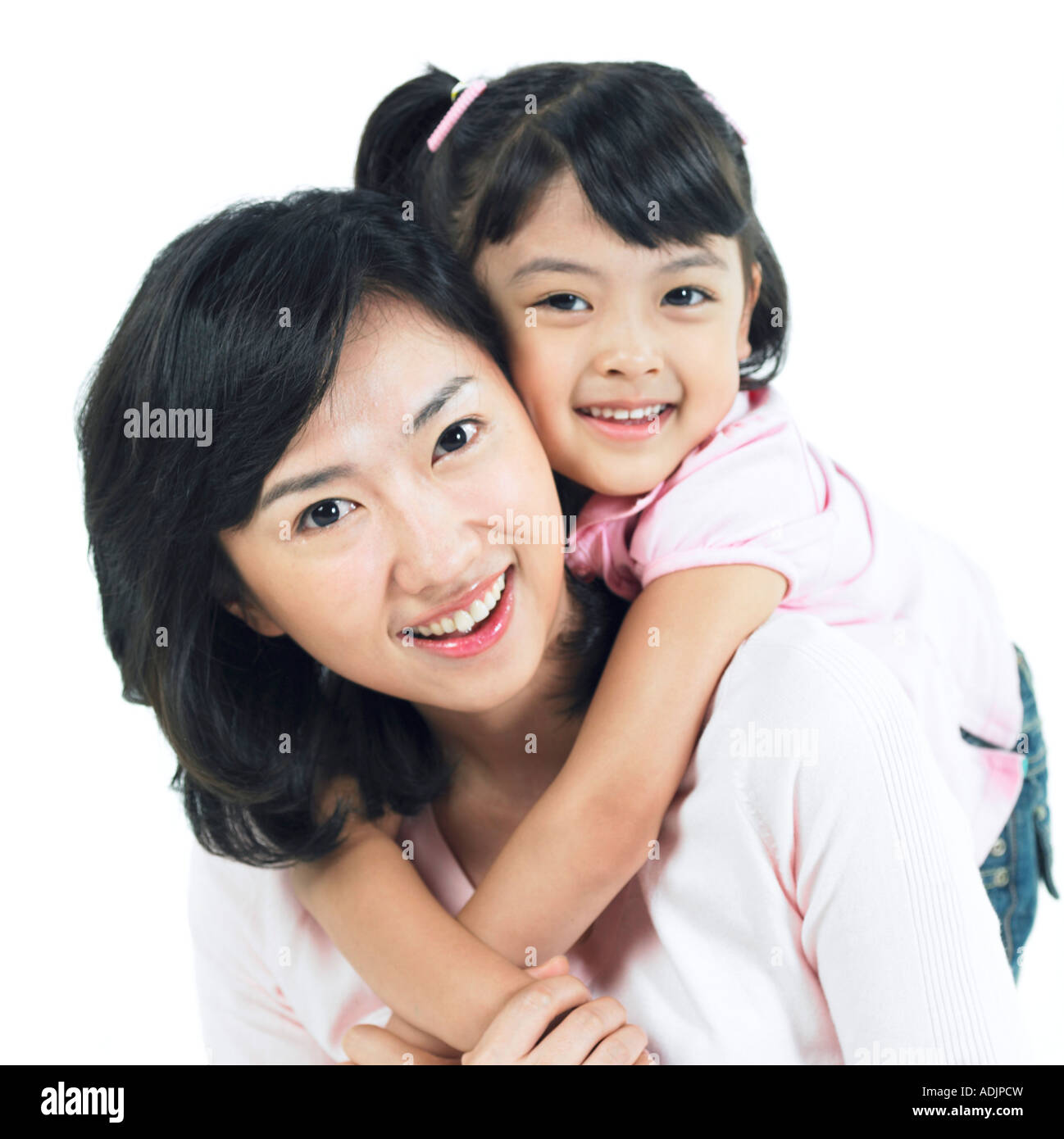 A Korean girl is hugging her mother with a smile Stock Photo - Alamy