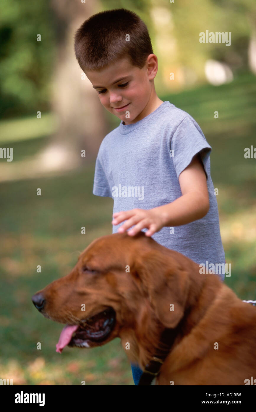 Boy petting his dog hi-res stock photography and images - Alamy