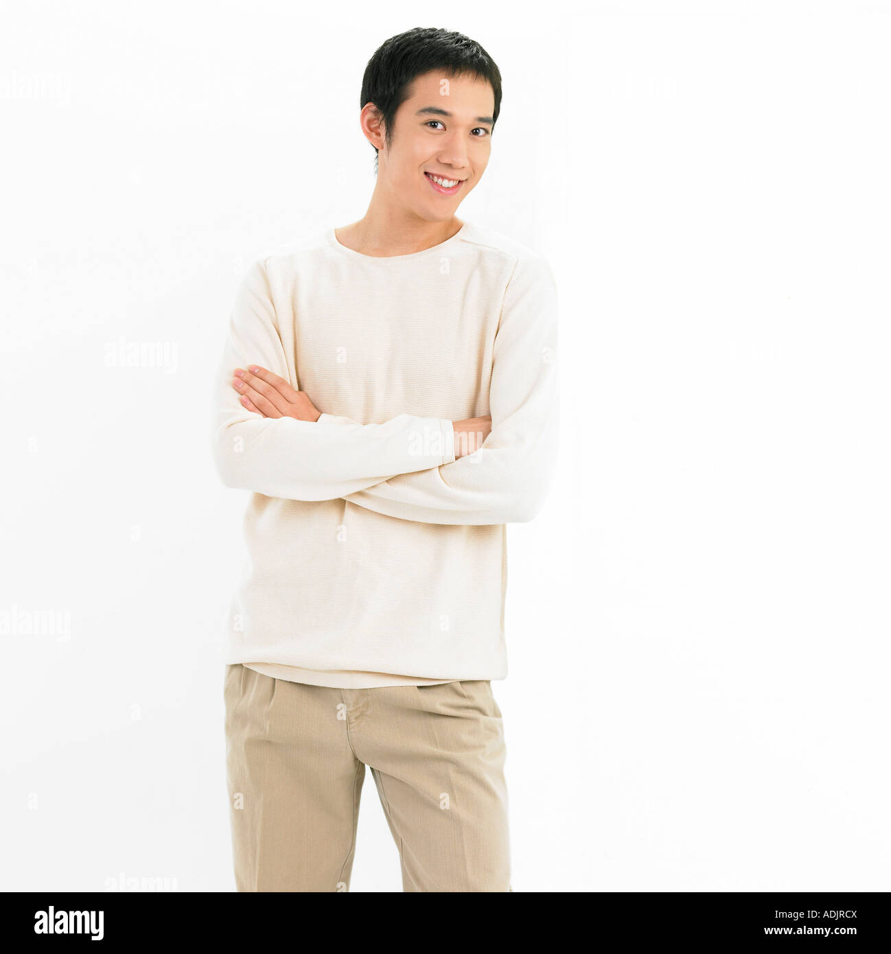 A smiling man is folding his arms Stock Photo - Alamy