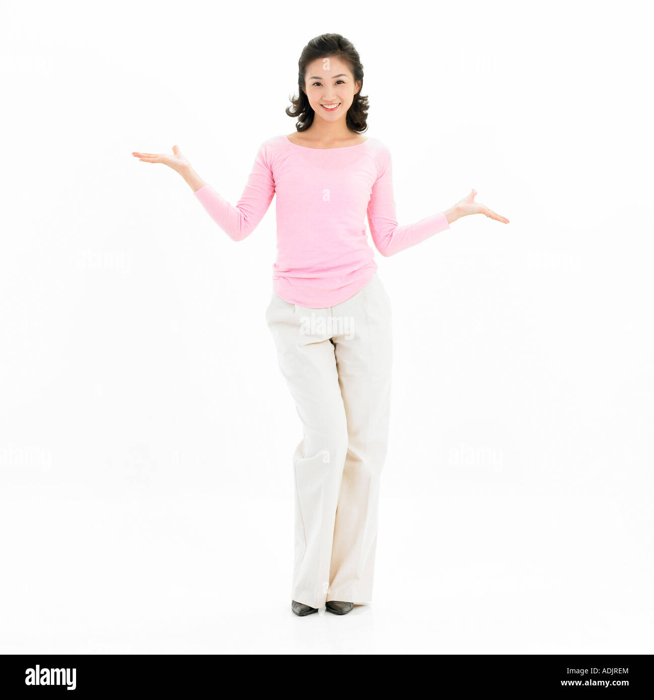 A smiling woman is making a gesture Stock Photo - Alamy